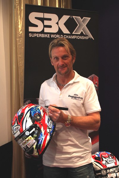 Win a signed Helmet by Carl Fogarty plus a copy of SBKX game and bag!