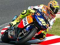 Capirossi crashes, Rossi goes quickest