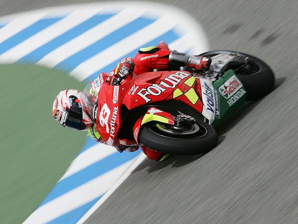 Capirossi takes pole