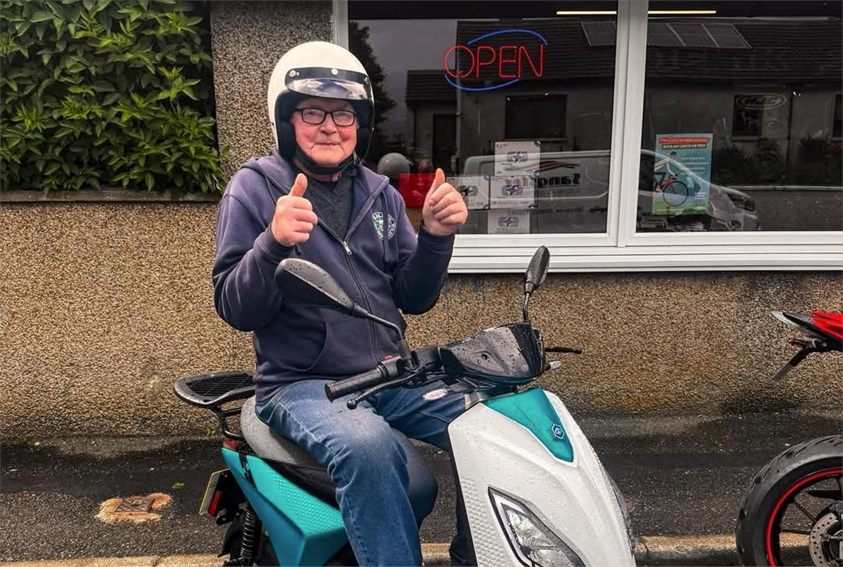 AMS Motorcycles gifts an electric scooter to 86 year old rider